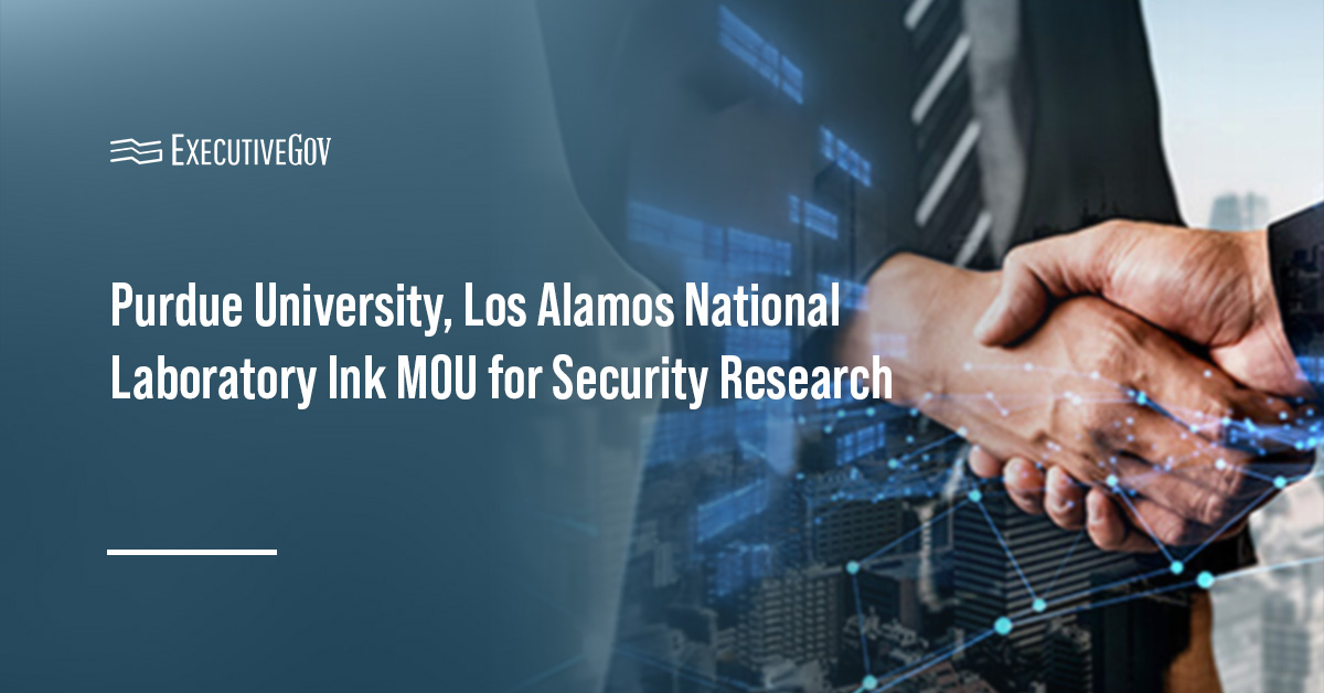 A handshake that represents partnership. LANL and Purdue University have inked an MOU for national security research.